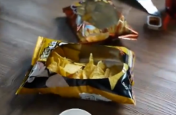 Here's the proper way to open a packet of crisps in the pub