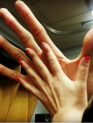 An NBA player's freakishly large hands compared to a normal person's