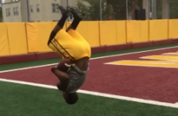 Wide receiver catches two footballs while doing a backflip · The 42