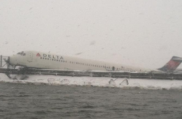 24 people injured as Delta plane skids off runway in snow storm
