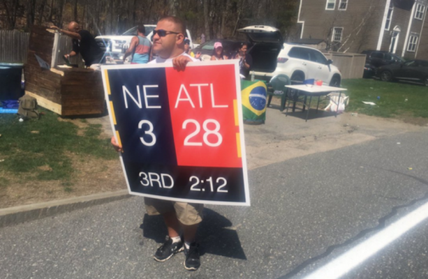 A Boston Marathon spectator held a sign with the Super Bowl score ...
