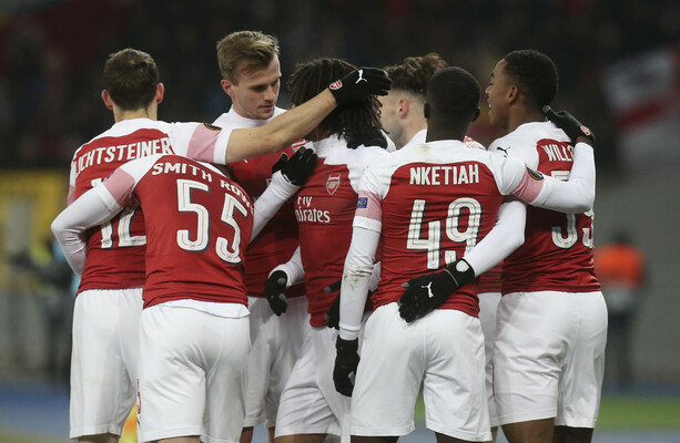 Arsenal progress as group winners after three first-half goals in cold Kiev