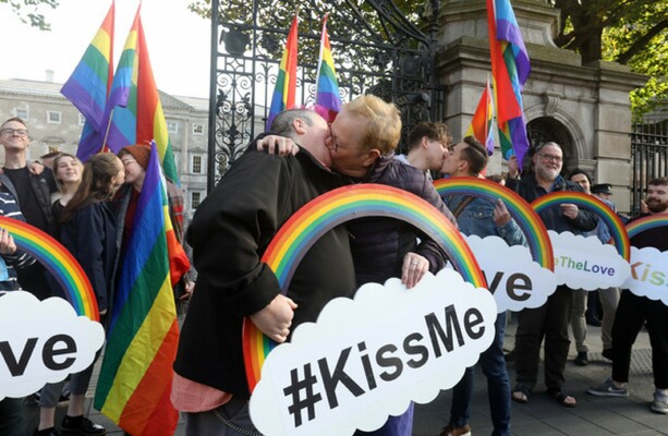 LGBT couples stage 'kissing protest' outside Dáil to demand hate crime ...
