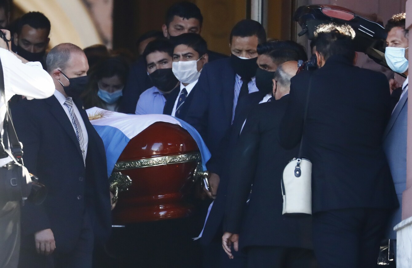 Fans gather along roads to bid farewell as Maradona buried in private ...