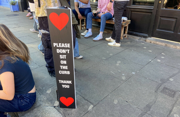 'Please don't sit on the curb' signs appear on Dublin's Drury Street