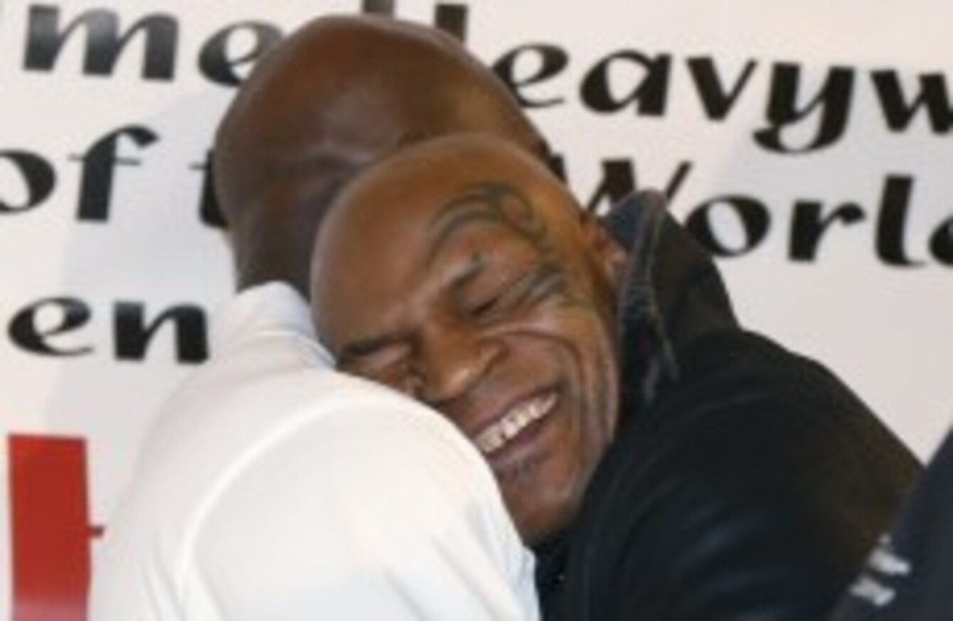 You have to see this photo of Mike Tyson giving Evander Holyfield a ...