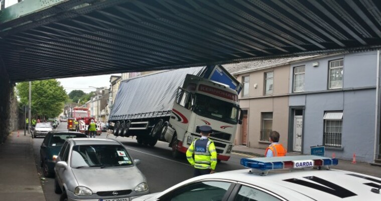 Rail services interrupted as truck gets stuck under bridge