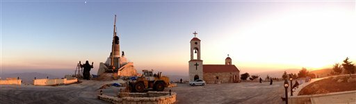 Armed groups hold their fire as giant bronze Jesus statue is erected on ...