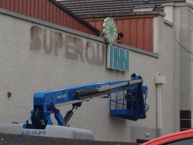 Pic: Superquinn sign is taken down to be replaced by SuperValu