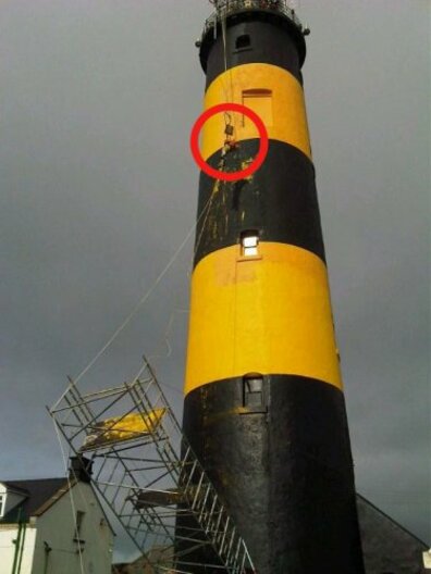 Man left dangling from lighthouse after scaffolding collapse