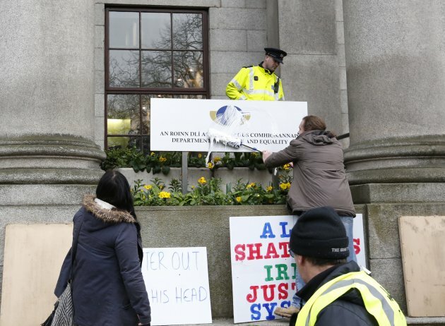 Photos: Four arrests after protesters throw paint at the Department of ...