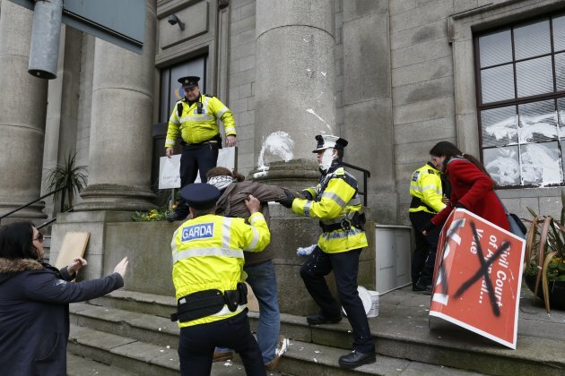 Photos: Four arrests after protesters throw paint at the Department of ...