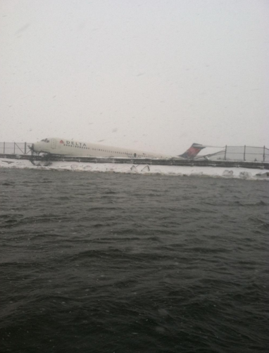 24 people injured as Delta plane skids off runway in snow storm
