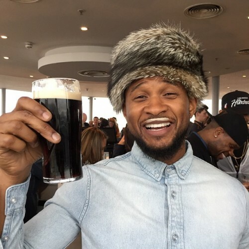 Usher is in Dublin, and sporting an excellent Guinness moustache
