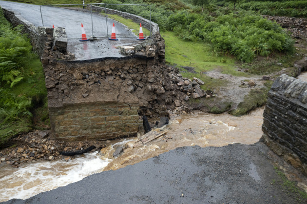 Bridge collapses in England as areas are hit by severe flooding