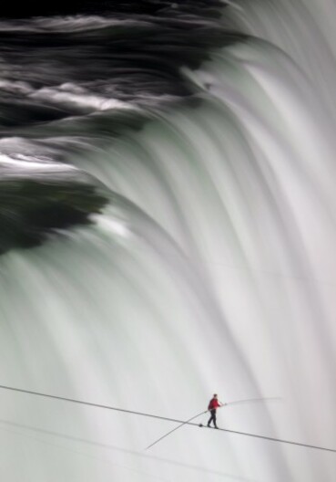 In pictures: Daredevil successfully walks tightrope across Niagara Falls