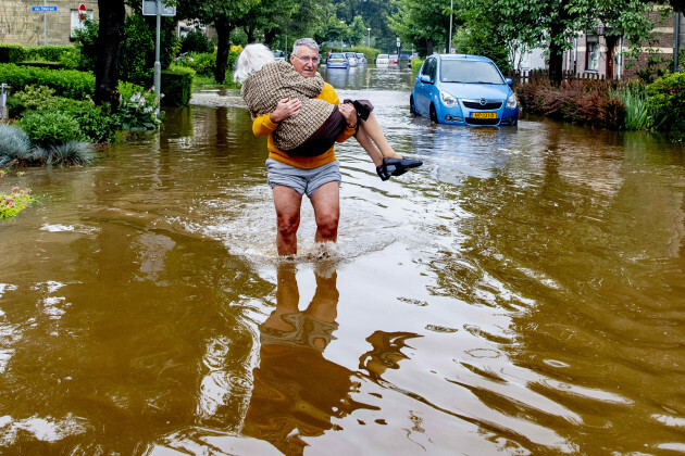 In photos: Lives lost and homes destroyed as devastating floods sweep ...