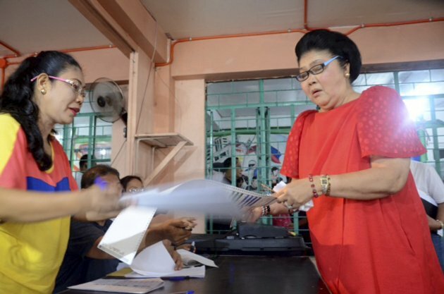 Pics: Filipino voters hit the polls in vital elections of over 18,000 ...